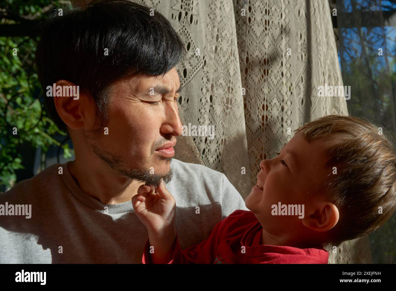 emotions of child and father Stock Photo - Alamy