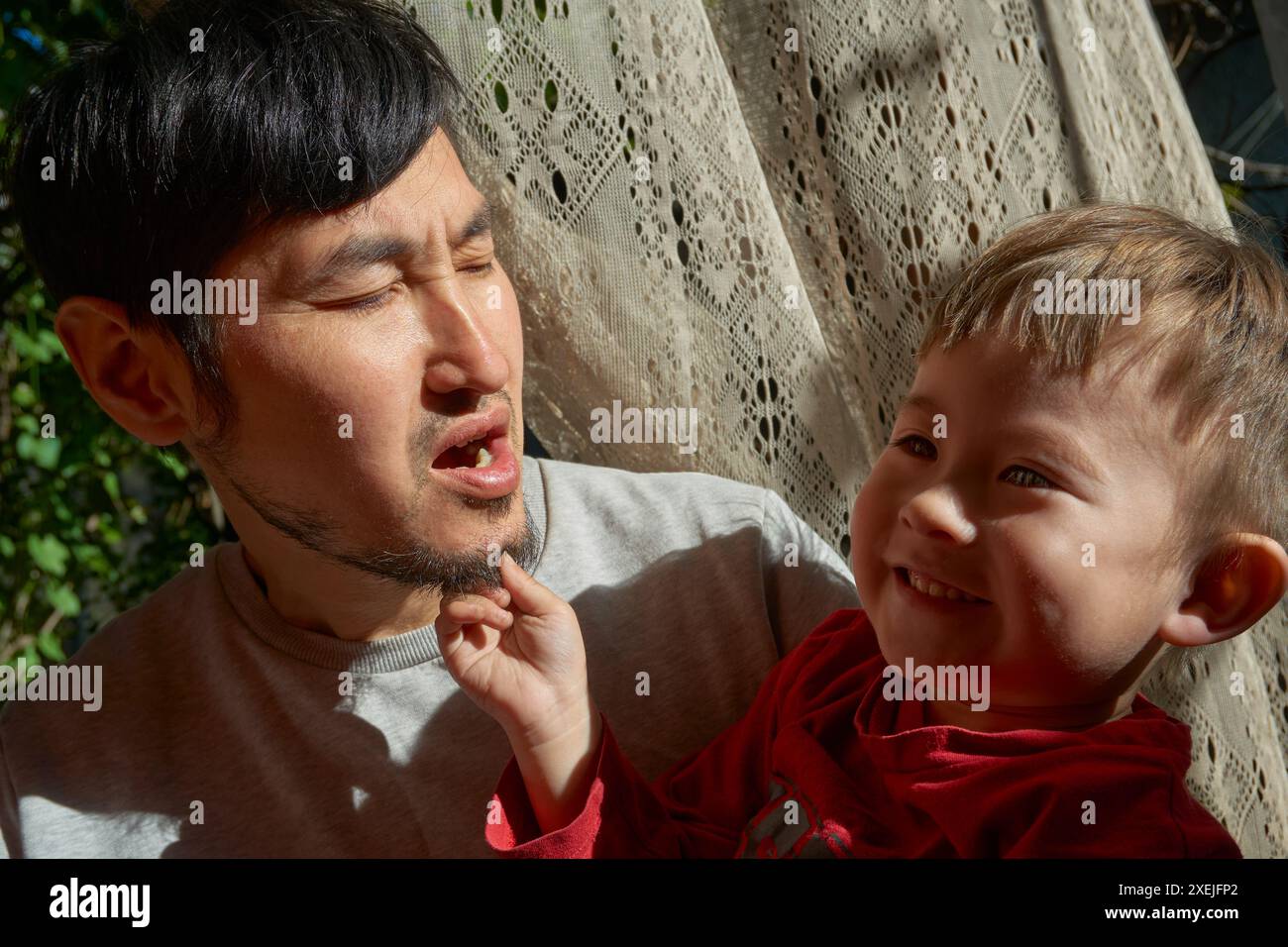 emotions of child and father Stock Photo - Alamy
