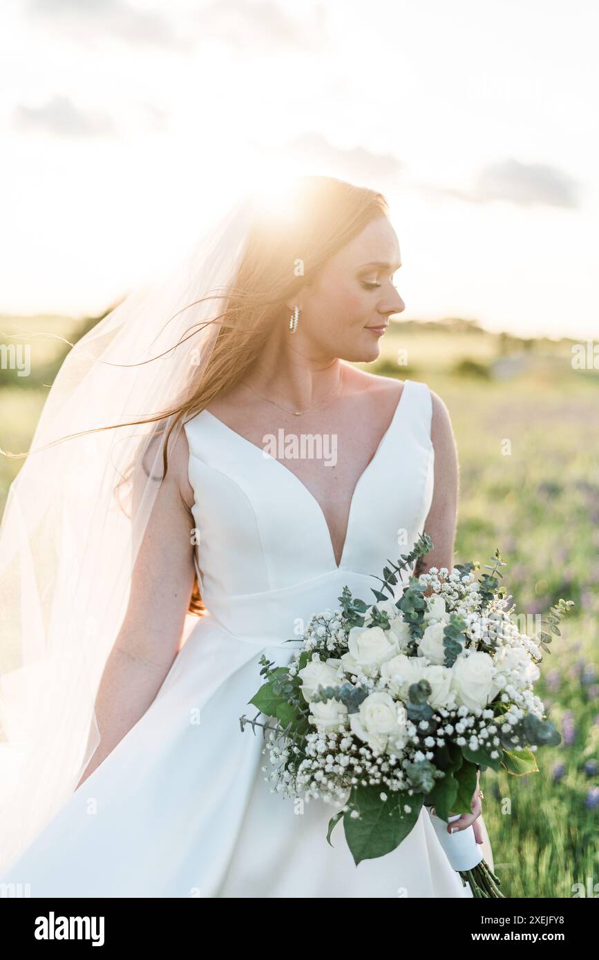 Sunset Glow: Redheaded Bride in Texas Wildflowers and Church Stock ...