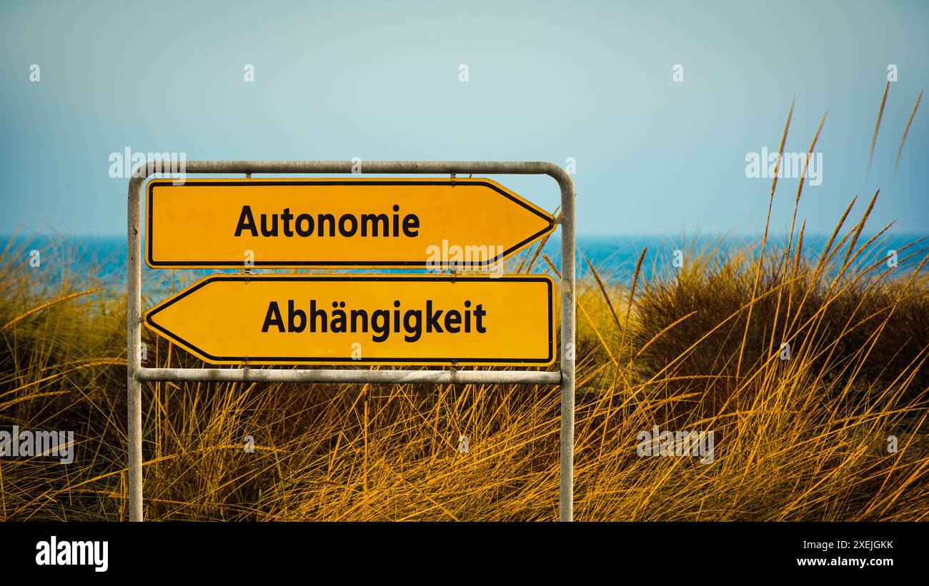 Signposts the direct way to Autonomy versus Dependency Stock Photo - Alamy