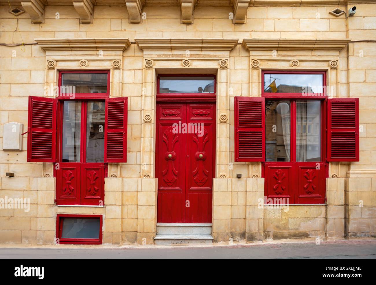 Traditional Maltese house, with colorful doors and windows. Zabbar ...