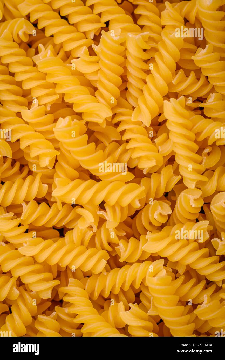 Raw fusilli pasta from whole grain wheat varieties Stock Photo - Alamy