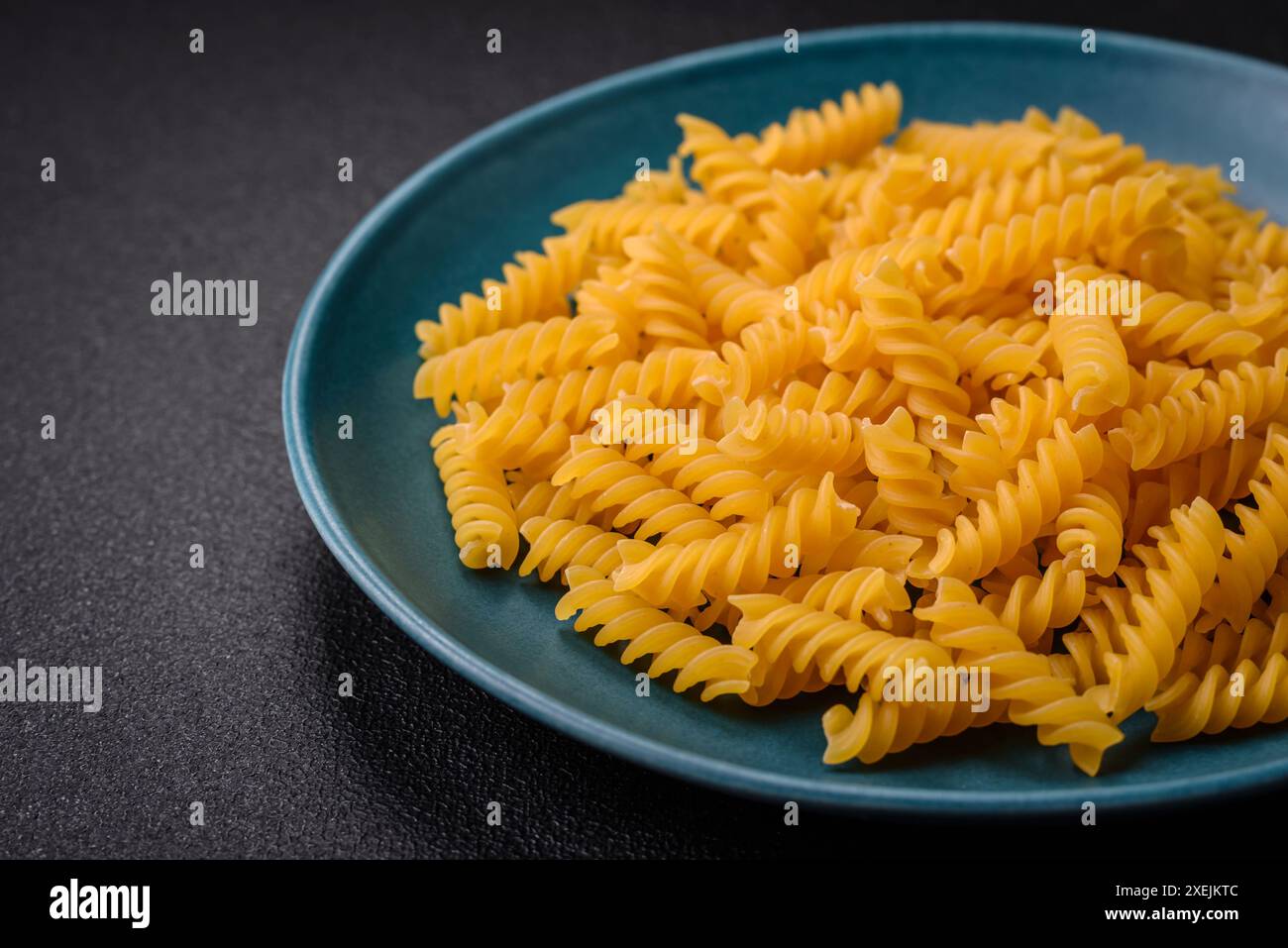 Raw fusilli pasta from whole grain wheat varieties Stock Photo - Alamy
