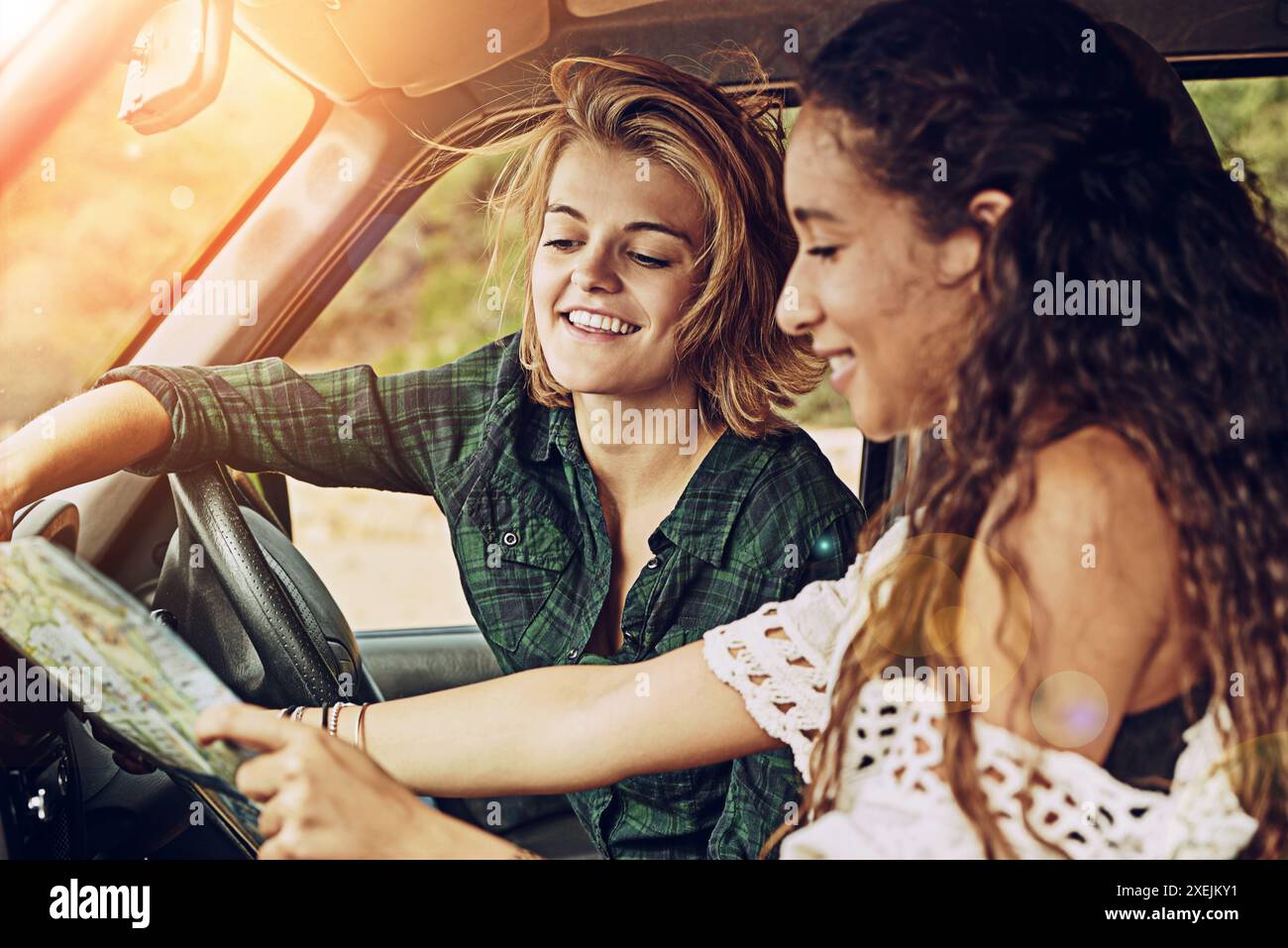 Car, reading map and friends travel on road trip, vacation and ...