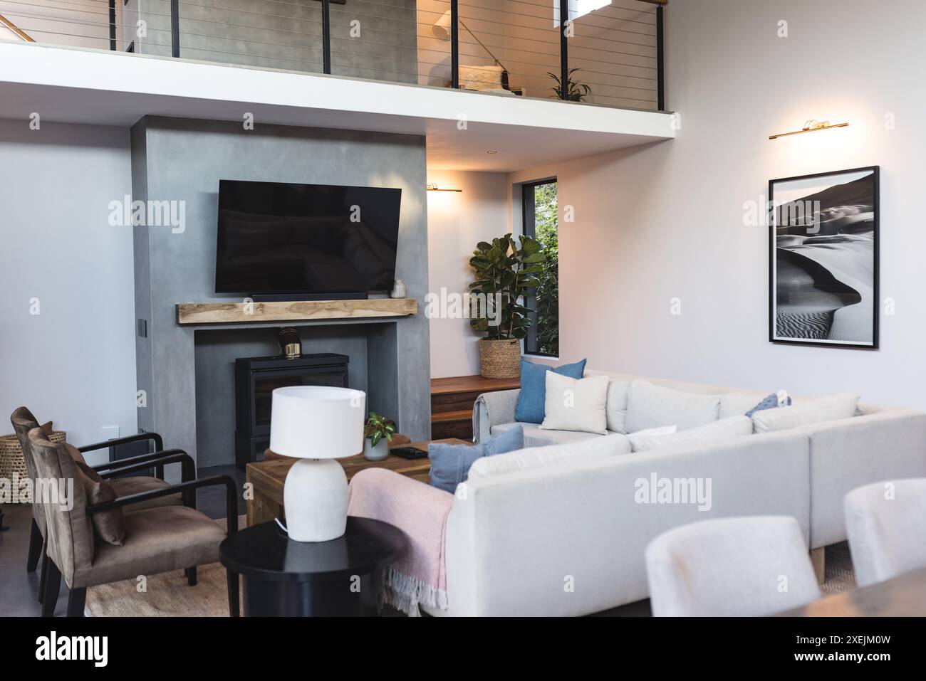 Modern living room with cozy furniture, large TV, and stylish decor ...