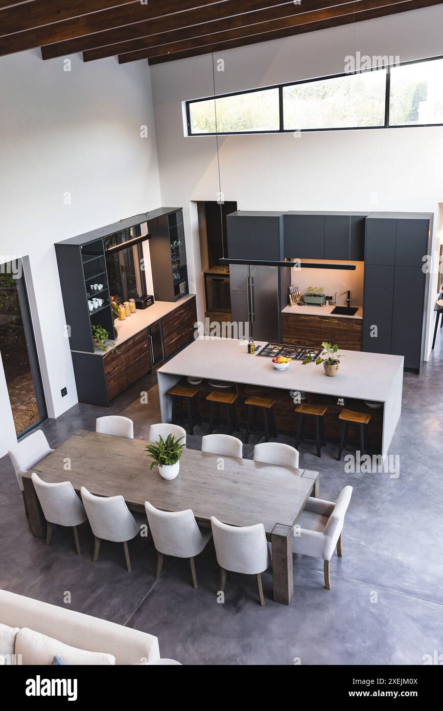 Modern kitchen and dining area with large table and stylish decor in ...