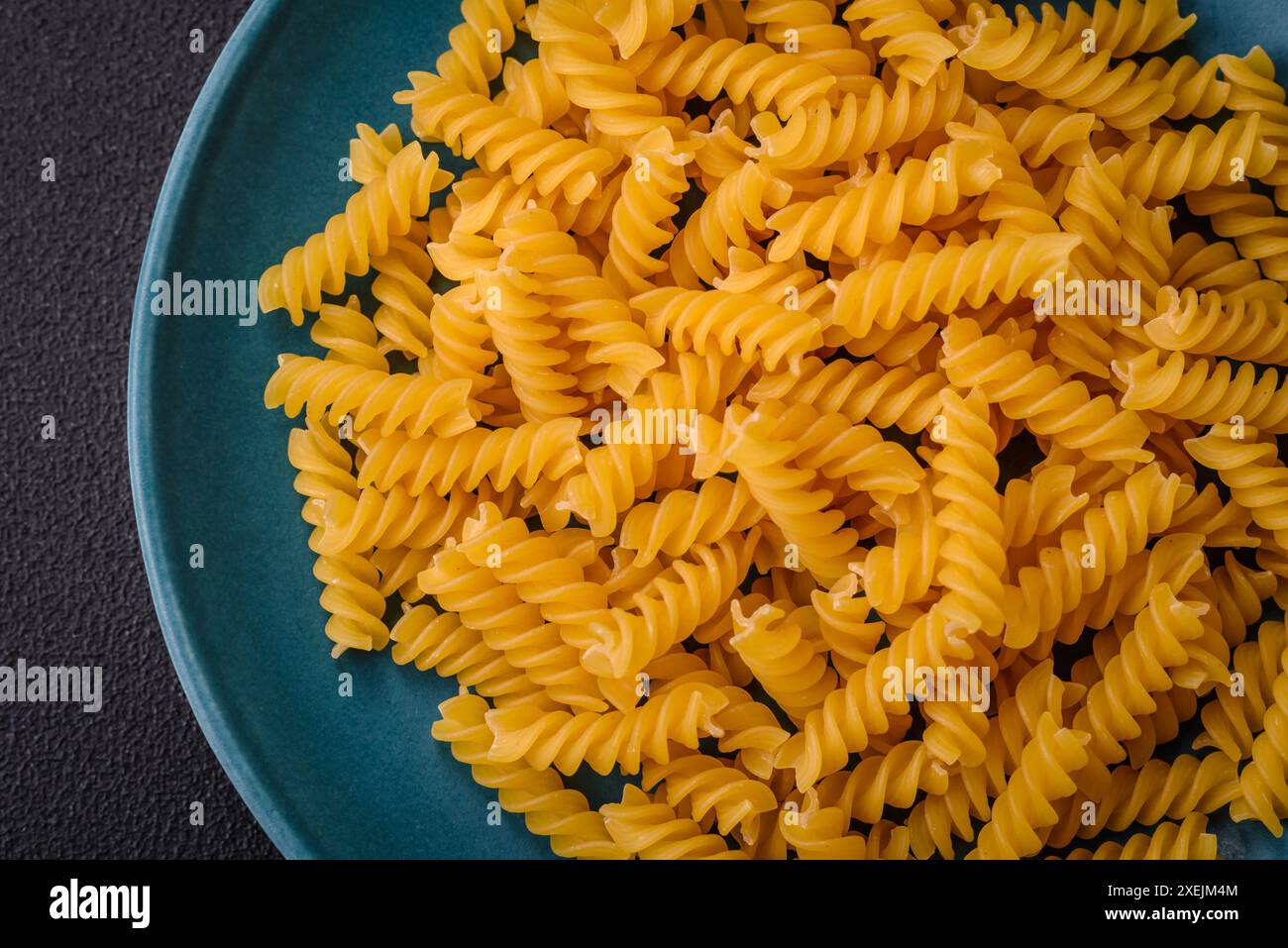 Raw fusilli pasta from whole grain wheat varieties Stock Photo - Alamy