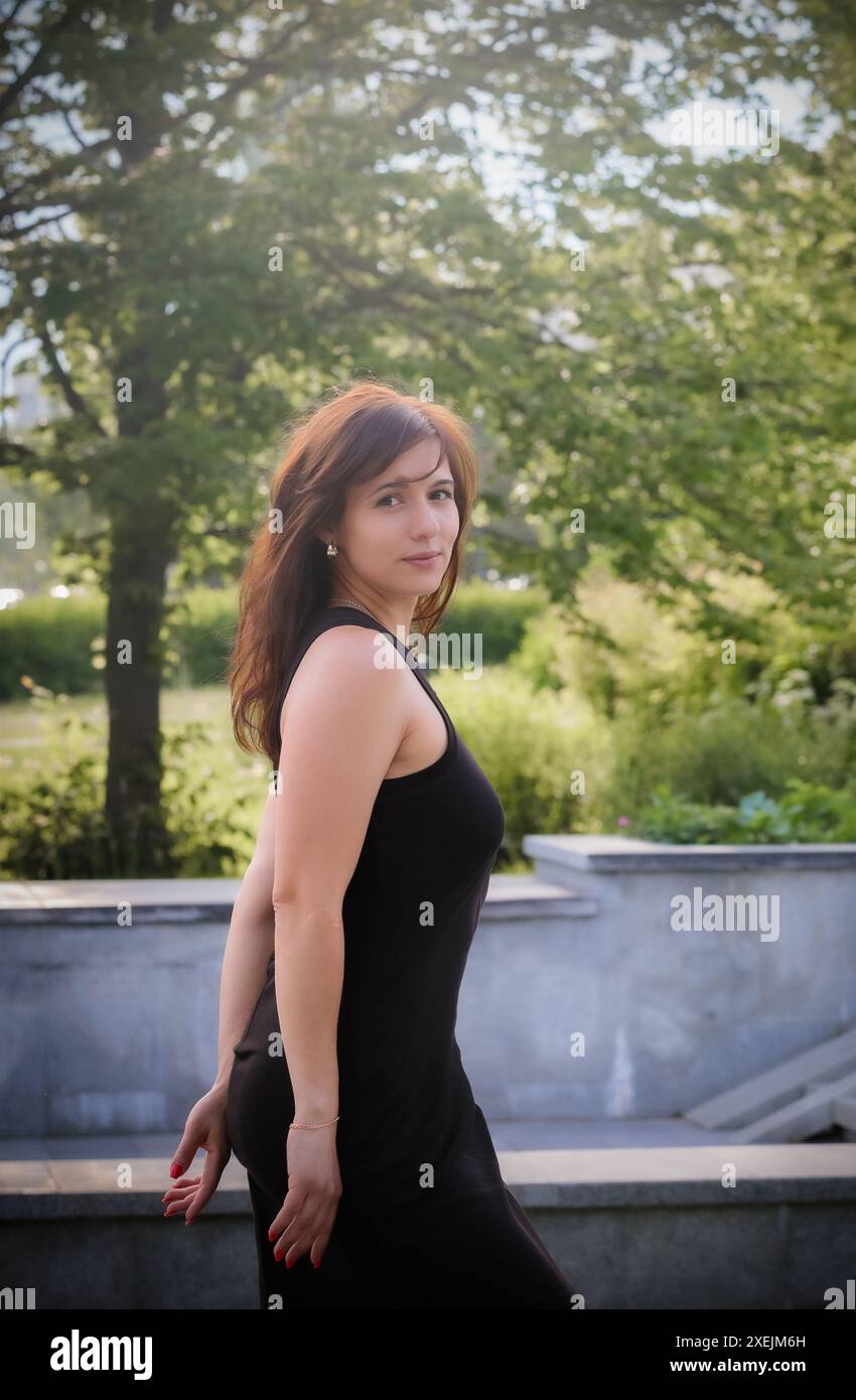 Stylish lady doing poses for photographer Stock Photo - Alamy