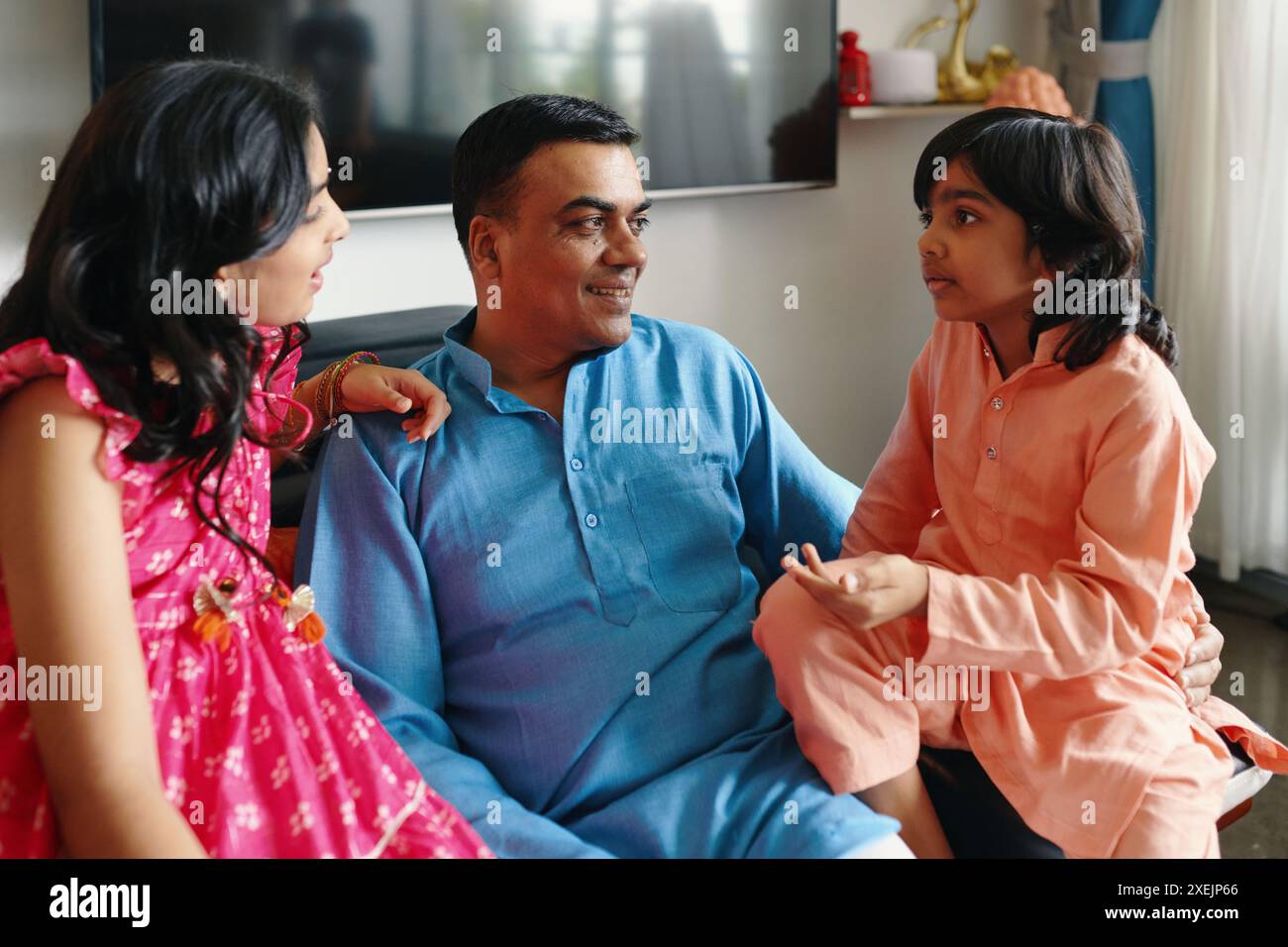Indian girl and dad talking hi-res stock photography and images - Alamy