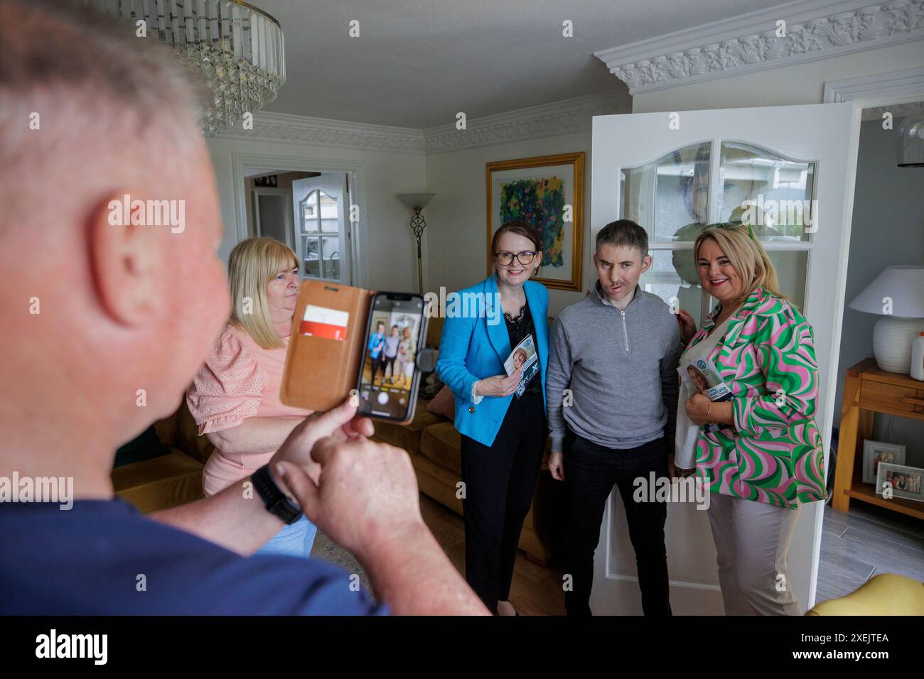 Oliver Brown (left) takes a picture of Sandra Duffy (right), Sinn Fein ...