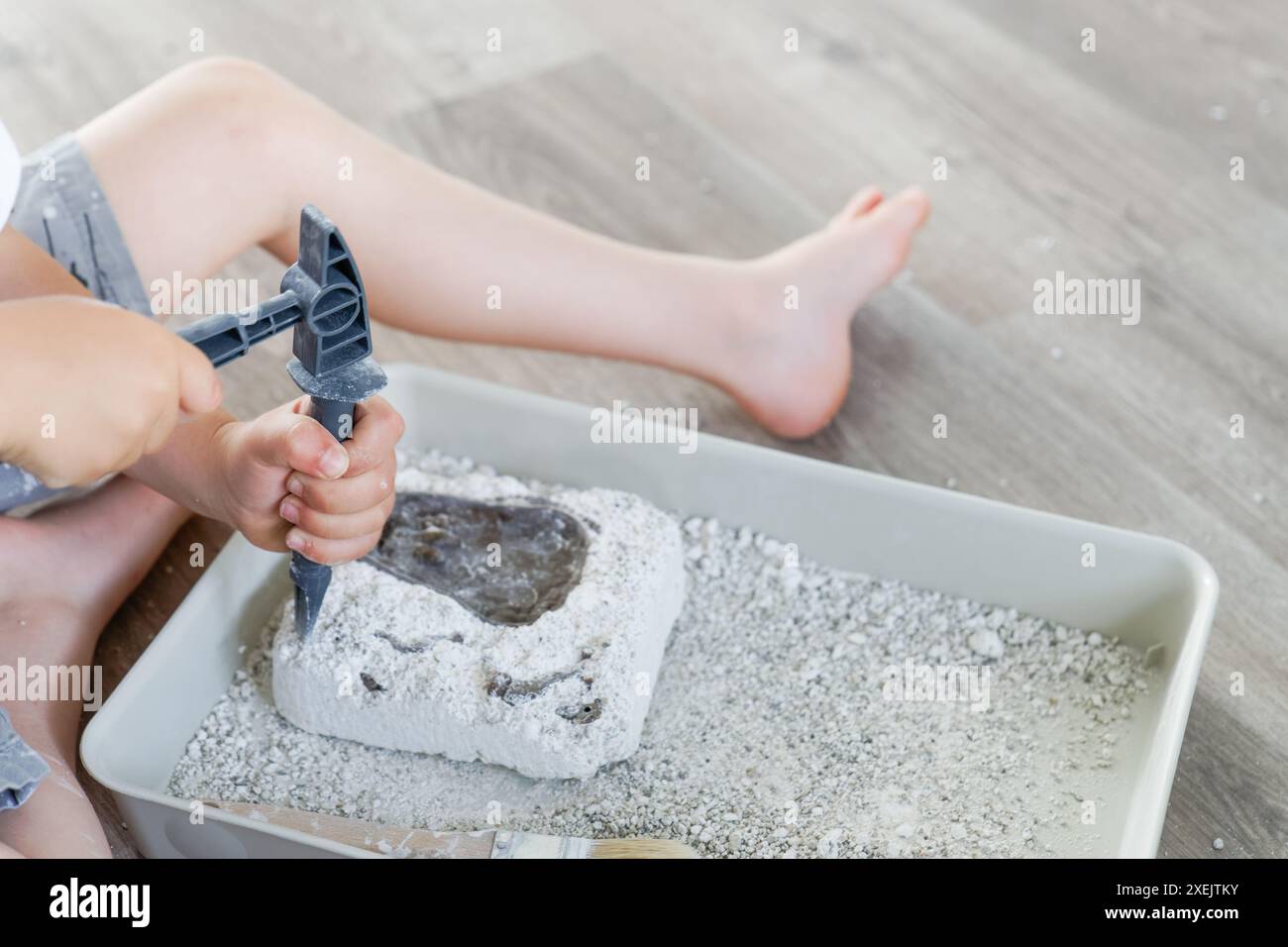 Child playing with a hammer and chisel Stock Photo - Alamy