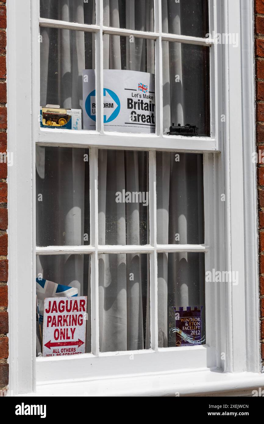 Windsor, UK. 27th June, 2024. A Reform UK poster is pictured in the ...
