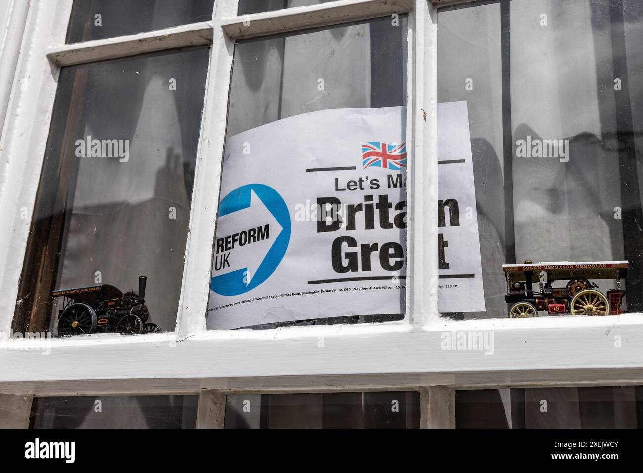 Windsor, UK. 27th June, 2024. A Reform UK poster is pictured in the ...
