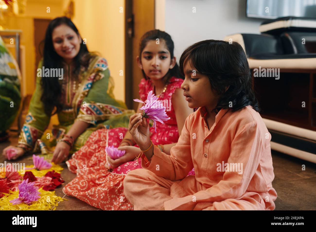 Children Making Rangoli With Mom Stock Photo - Alamy