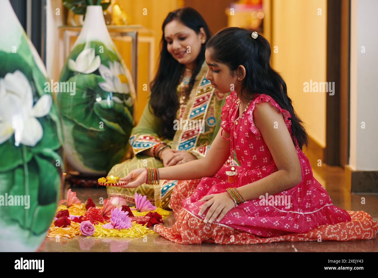 Girl Making Flower Composition With Candles Stock Photo - Alamy