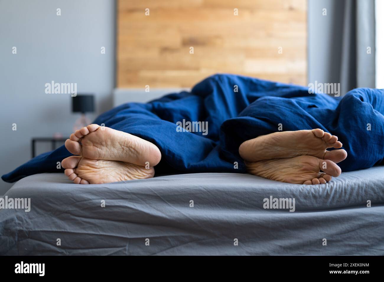 Generic stock photo of a couple's feet in bed. See PA Feature WELLBEING ...