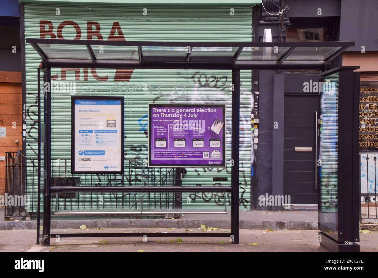 London, UK. 28th June 2024. A poster on a bus stop in Camden displays ...