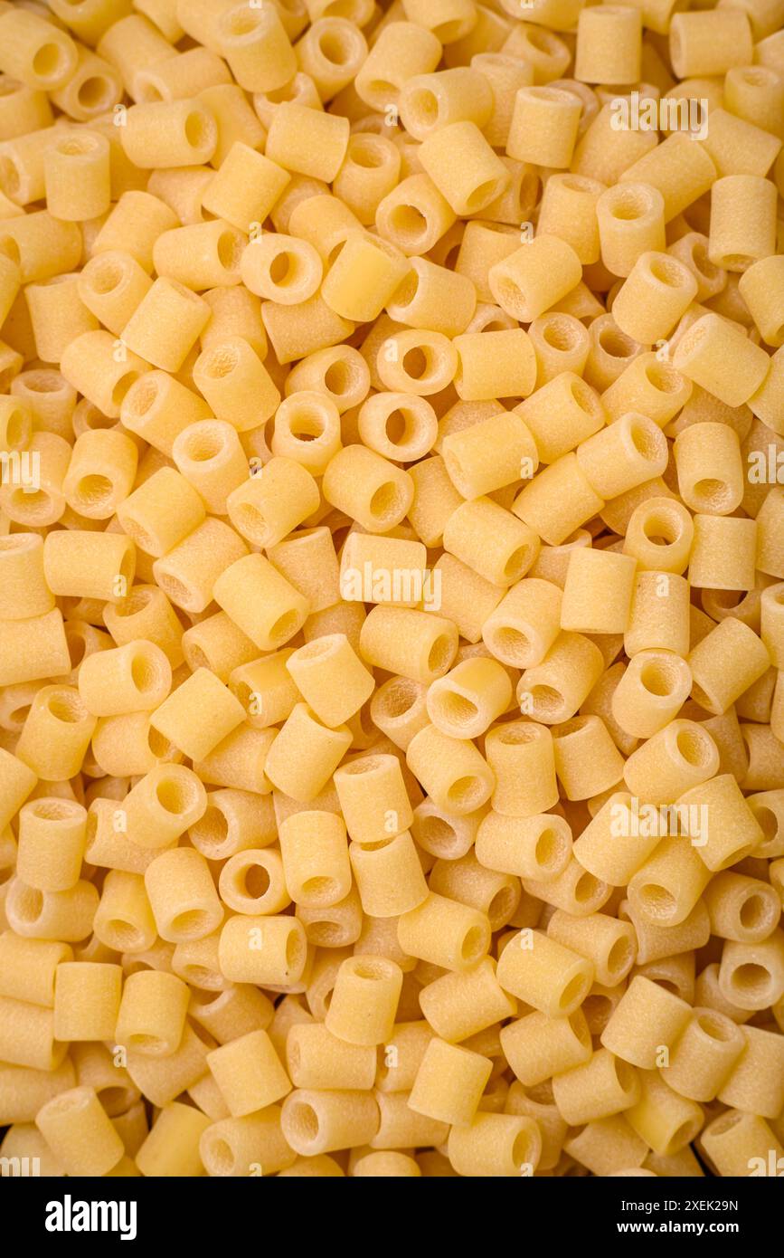 Delicious ditali pasta from durum wheat with salt and spices on a dark ...