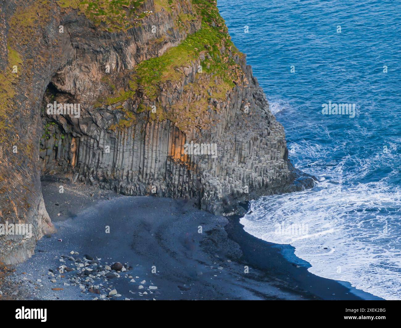 Black Sand Beach with Basalt Columns and Cliffside Cave in Iceland ...