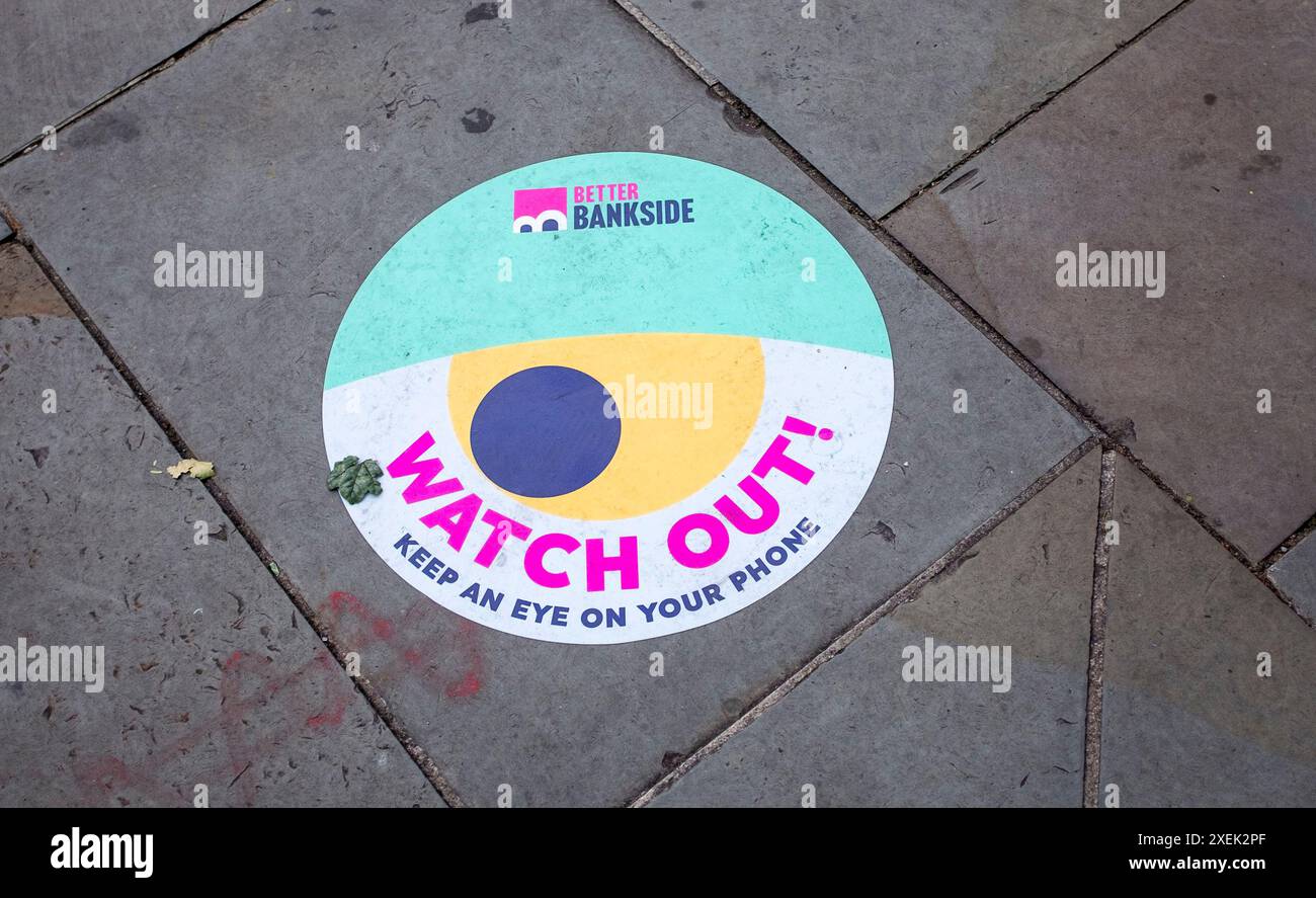 A pavement Watch Out sign in London warning visitors to be careful with ...