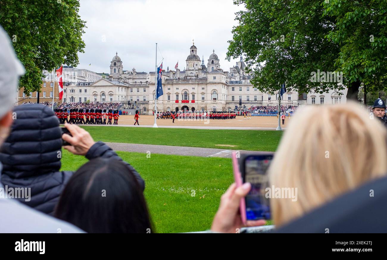 Watching Trooping the Colour at Horseguards Parade in the rain , London ...