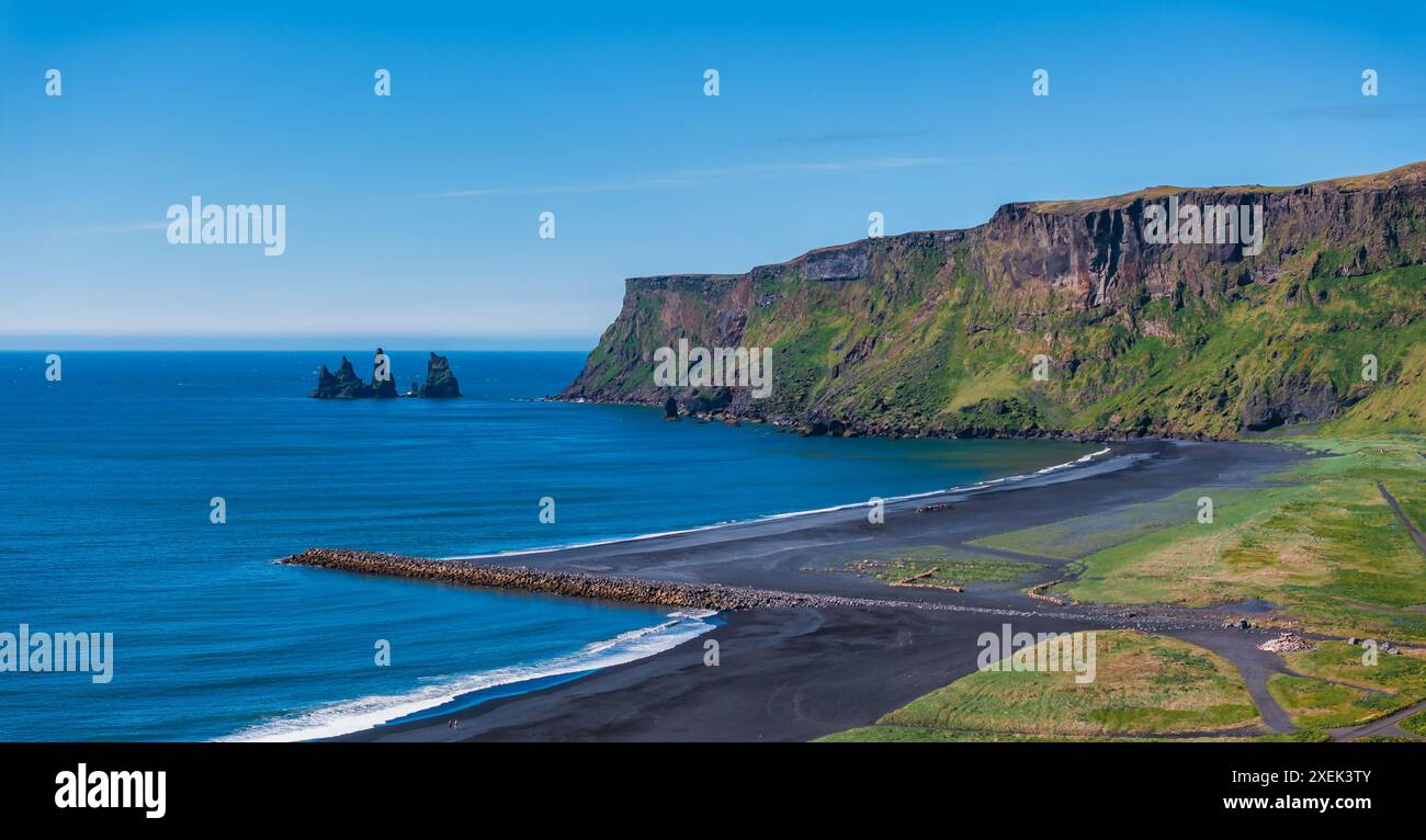 Black Sand Beach with Rock Formations and Cliff in Iceland Stock Photo ...