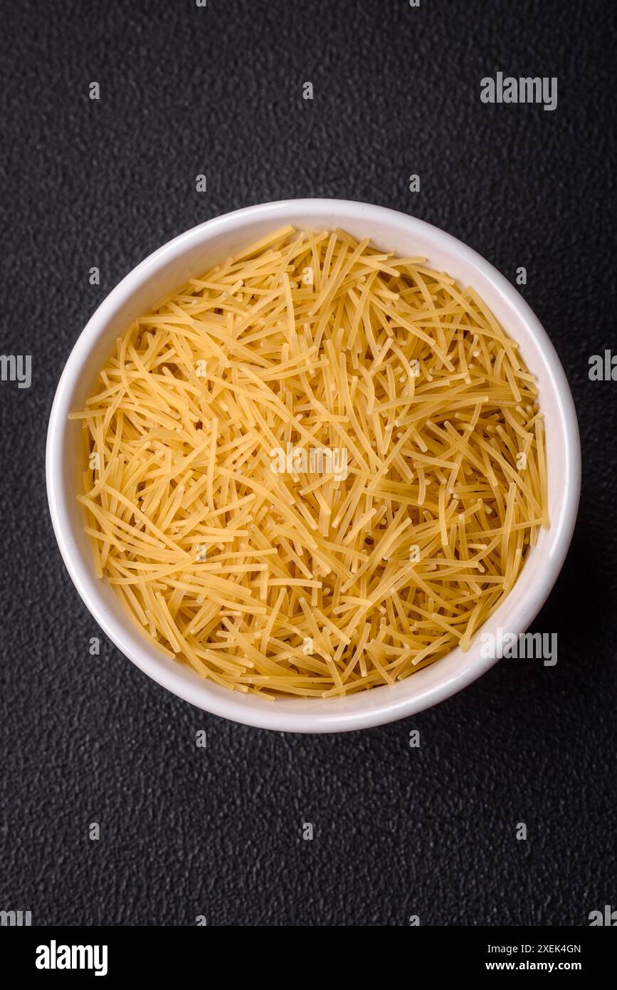 Fine vermicelli paste is yellow in color when raw Stock Photo - Alamy