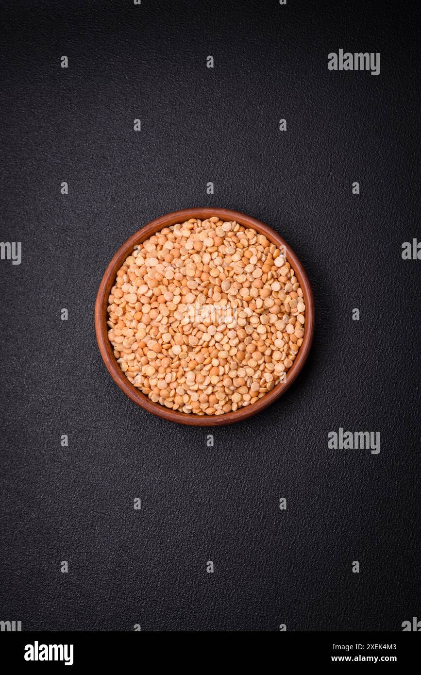 Dried pea grains, divided into halves, are yellow in color when raw ...