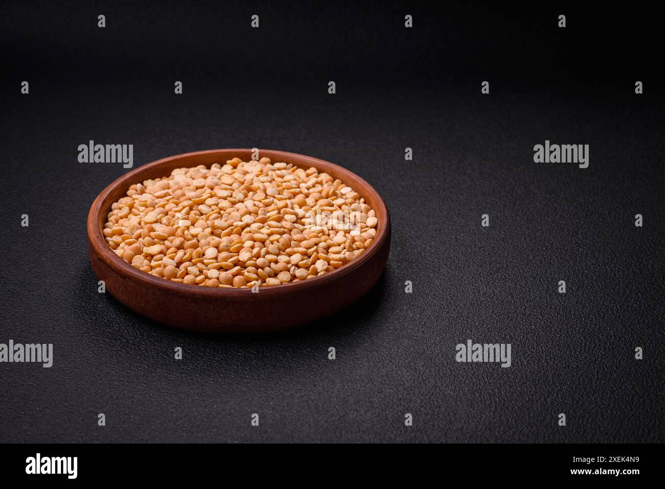 Dried pea grains, divided into halves, are yellow in color when raw ...