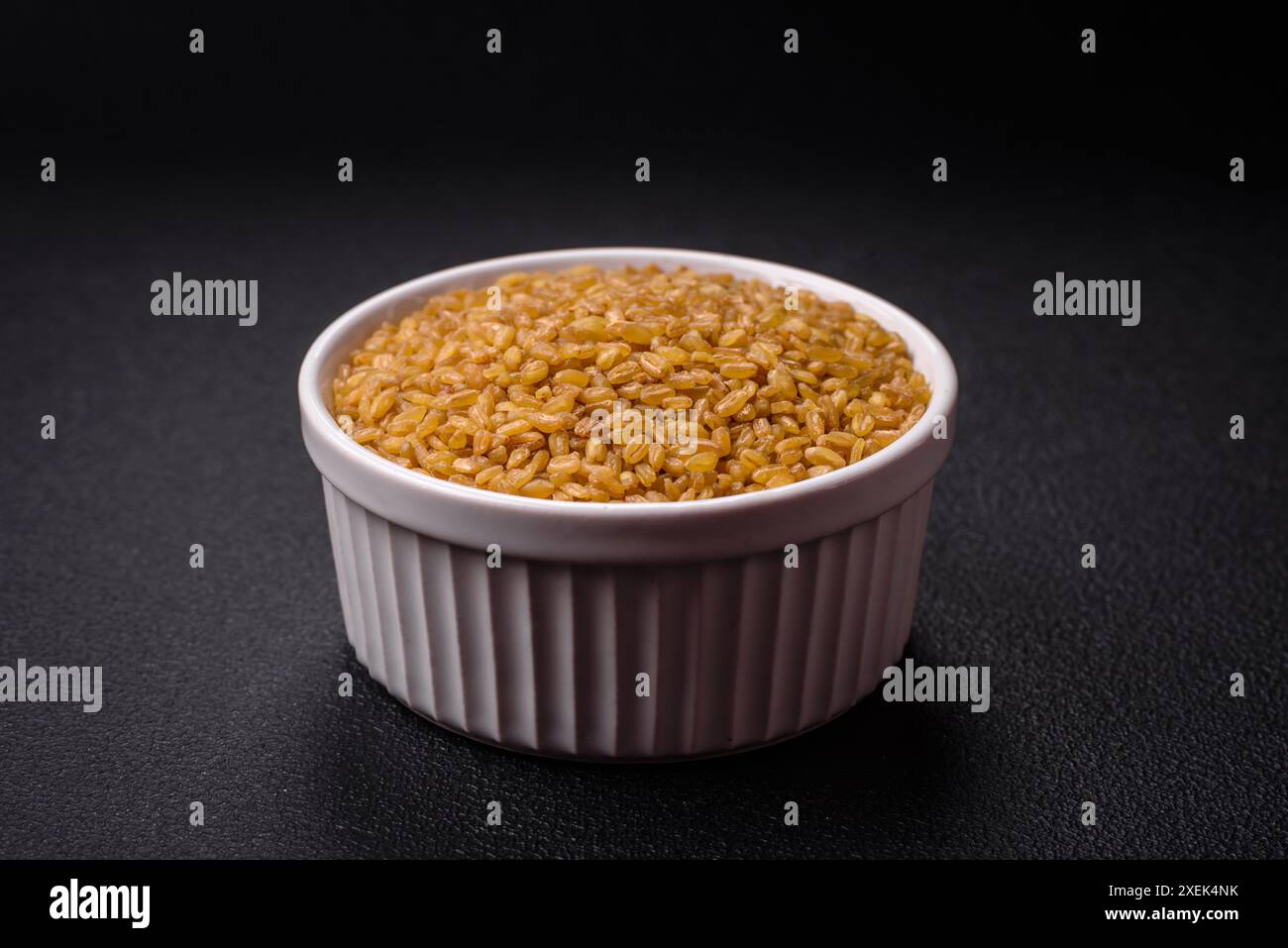 Bulgur wheat grains are yellow in color when raw Stock Photo - Alamy