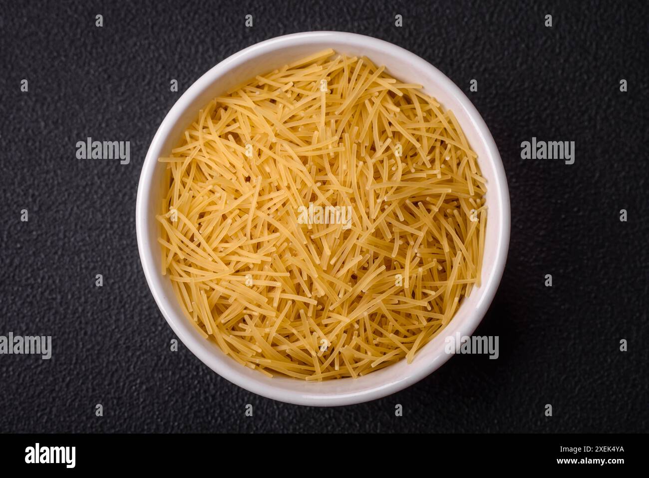Fine vermicelli paste is yellow in color when raw Stock Photo - Alamy