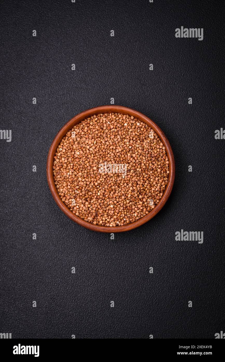 Large grains of raw buckwheat porridge are brown in color Stock Photo ...