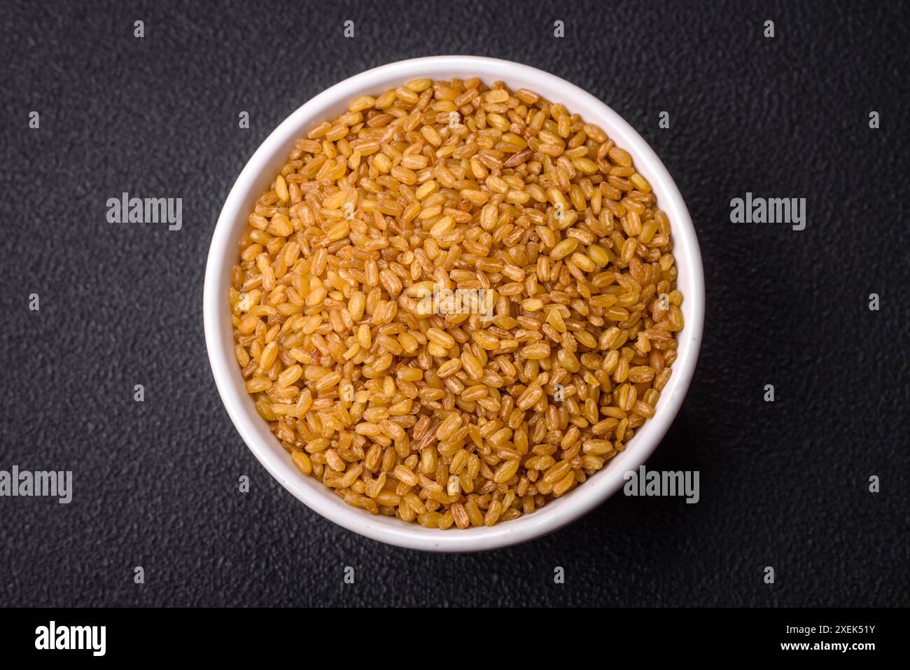 Bulgur wheat grains are yellow in color when raw Stock Photo - Alamy