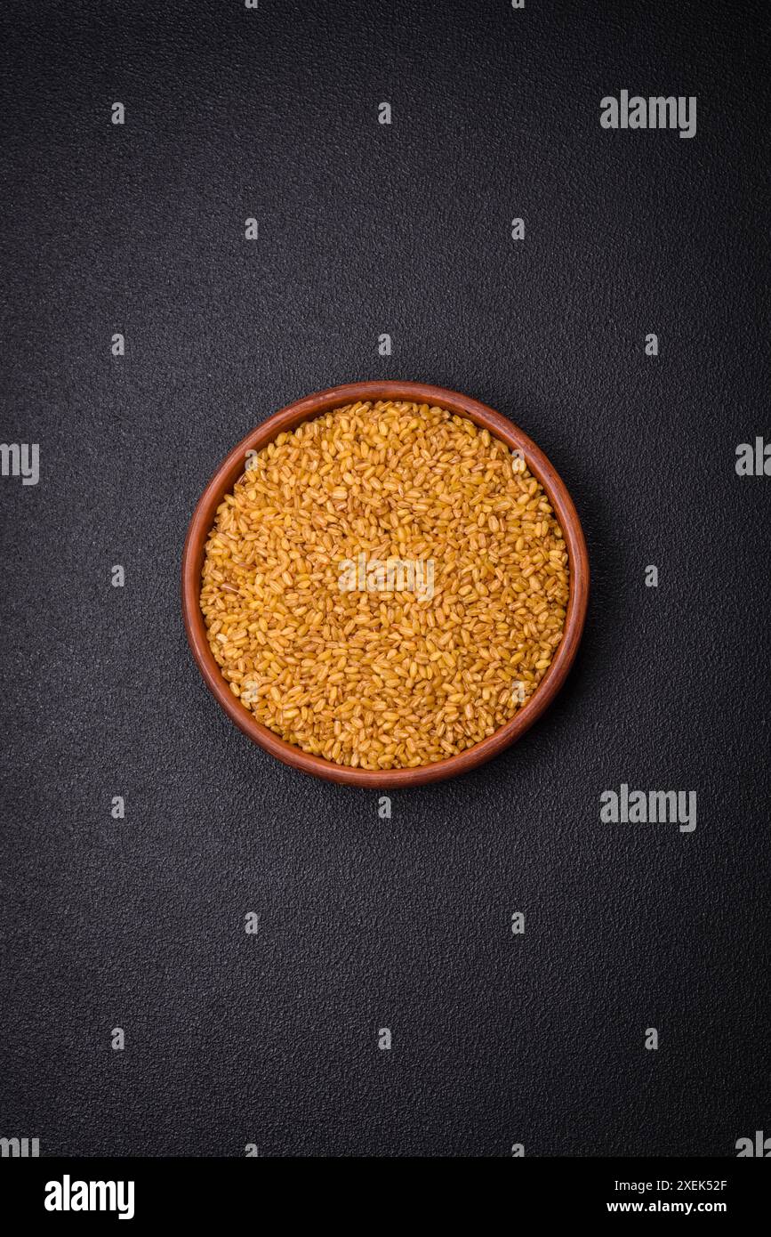 Bulgur wheat grains are yellow in color when raw Stock Photo - Alamy