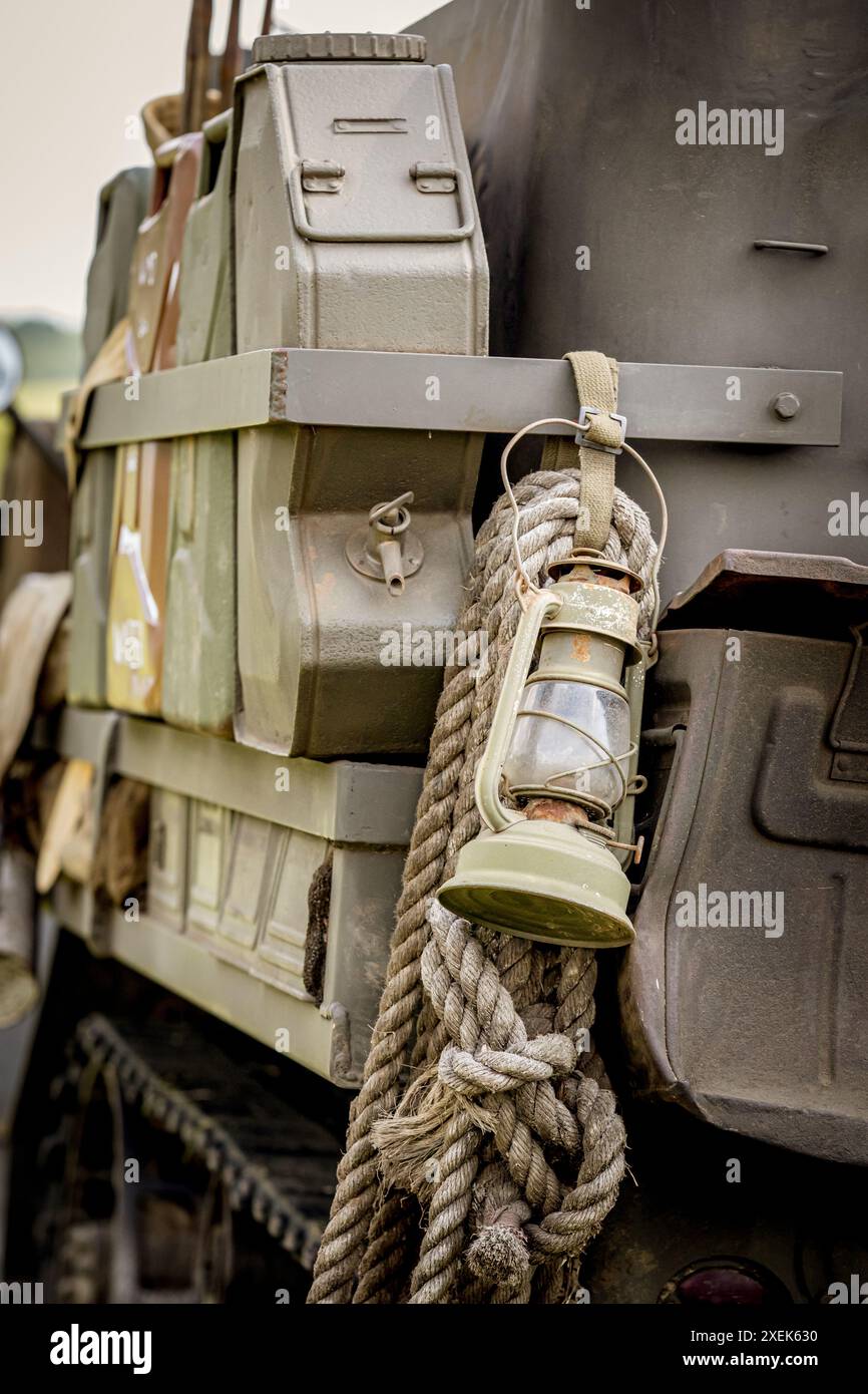 An old oil lamp hung on the back of a World War 2 (WW2) tracked army ...