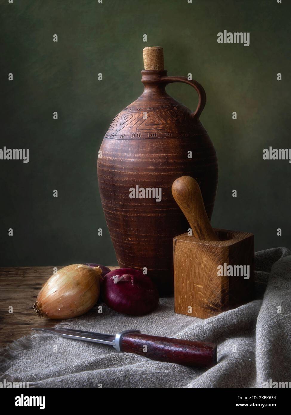 Still life with clay jug and onion Stock Photo - Alamy