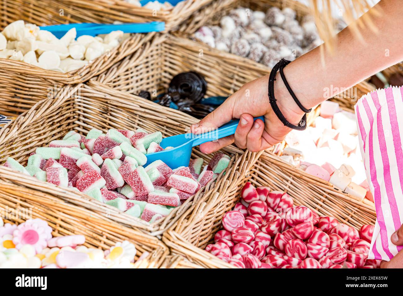 Female hand scooping pink hi-res stock photography and images - Alamy