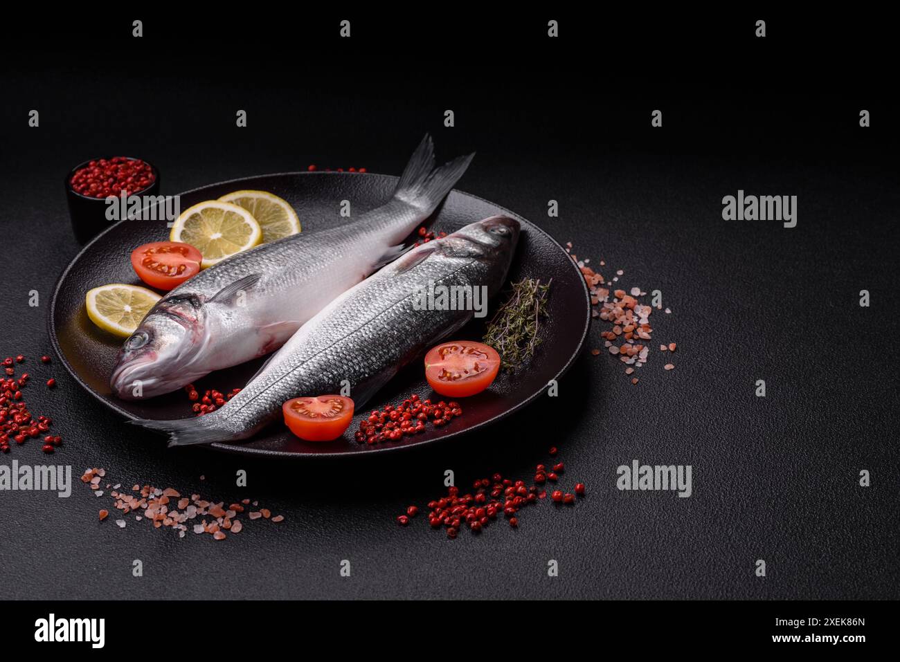 Fresh raw ocean sea bass fish with salt Stock Photo - Alamy