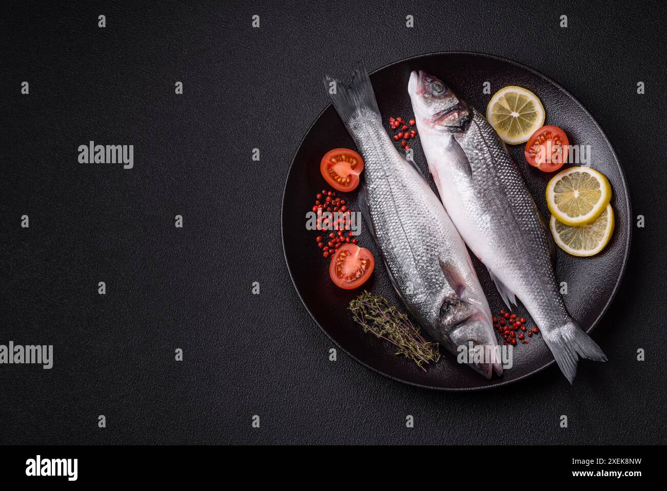 Fresh raw ocean sea bass fish with salt Stock Photo - Alamy