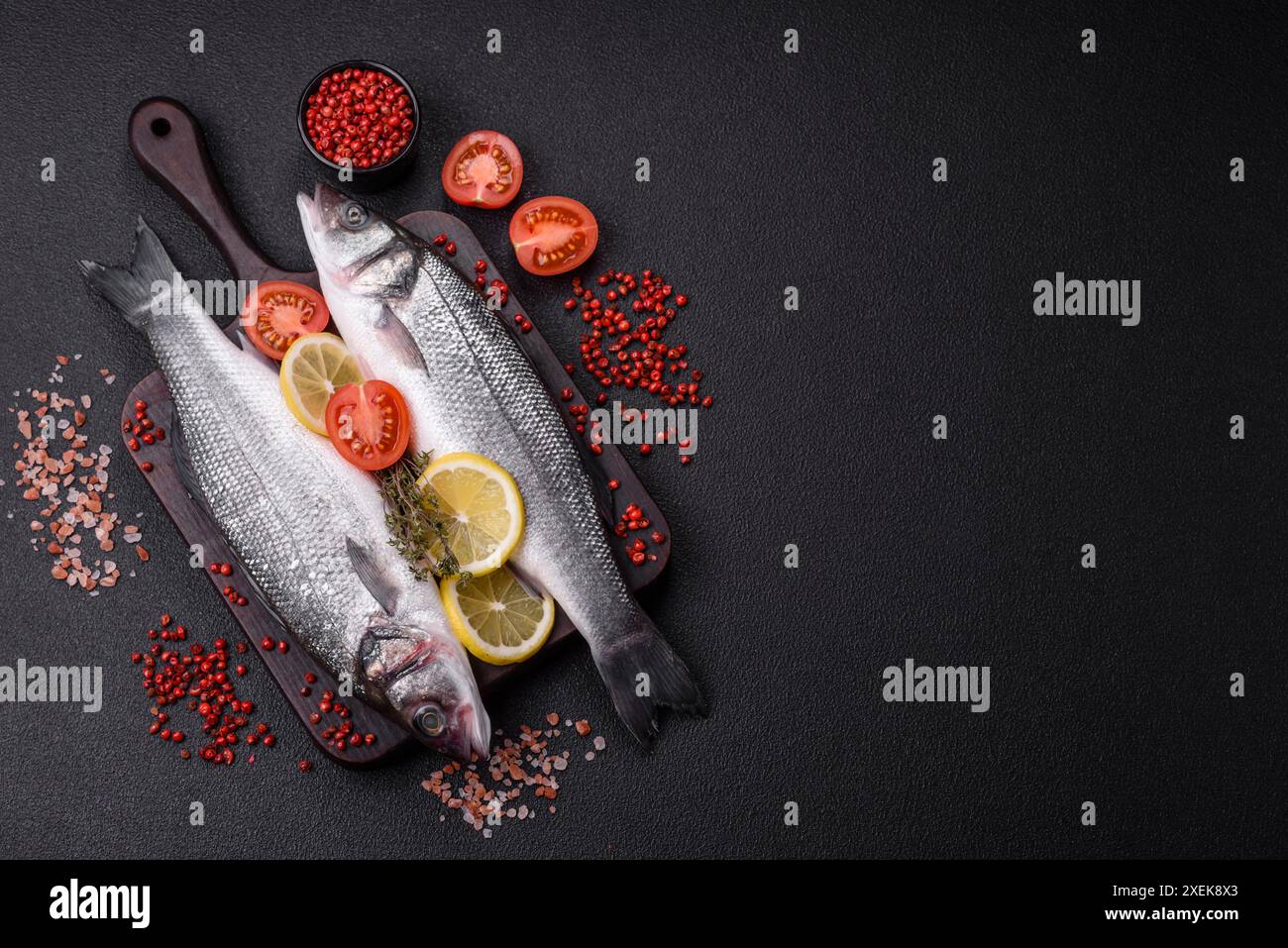 Raw seabass fish herbs hi-res stock photography and images - Alamy