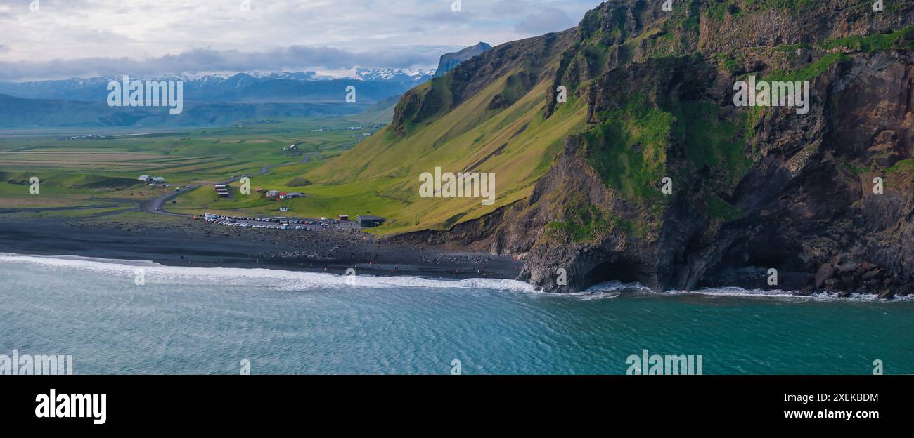 Aerial View of Icelandic Cliff and Black Sand Beach Meeting Turquoise ...