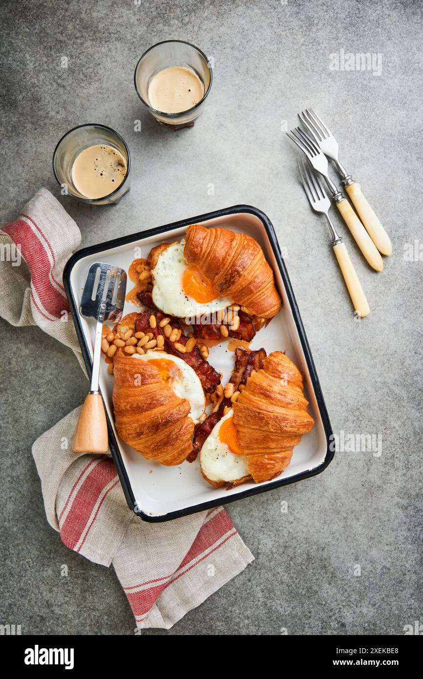 Croissants English breakfast. Delicious fresh breakfast grilled three ...