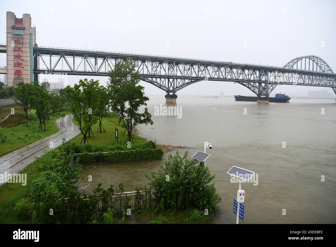 JIUJIANG, CHINA - JUNE 28, 2024 - The Jiujiang Yangtze River Bridge is ...