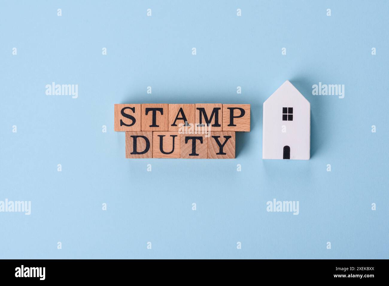 The inscription Stamp Duty made of wooden cubes on a plain background ...