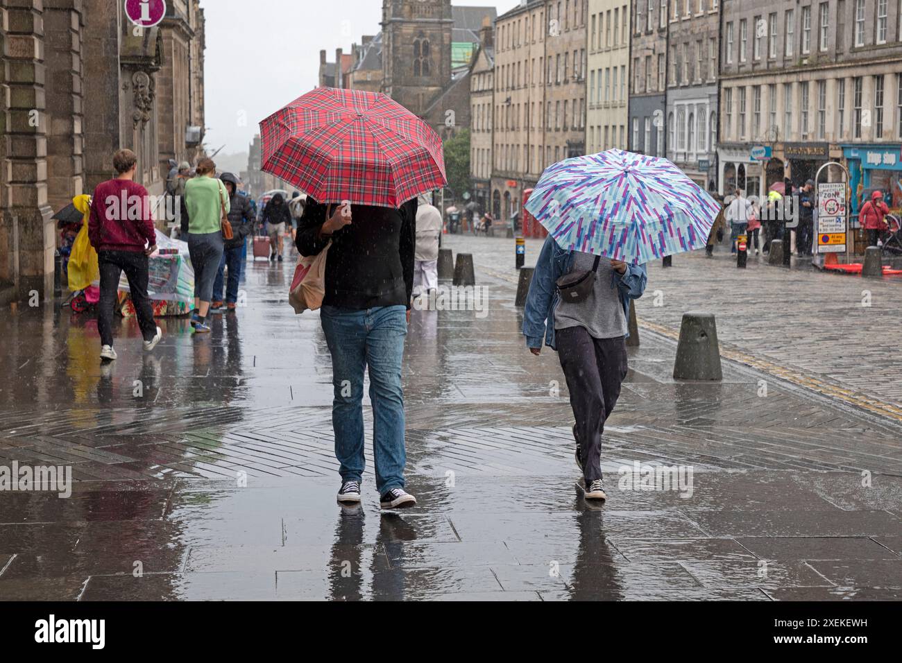 Edinburgh city centre, Scotland, UK. 28th June 2024. Heavy rain showers ...