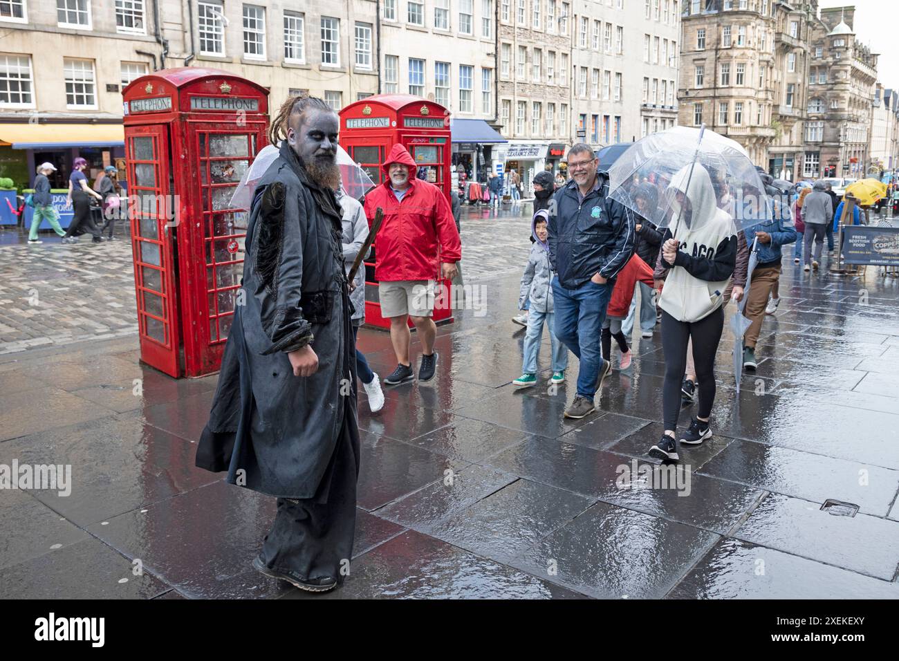 Edinburgh city centre, Scotland, UK. 28th June 2024. Heavy rain showers ...