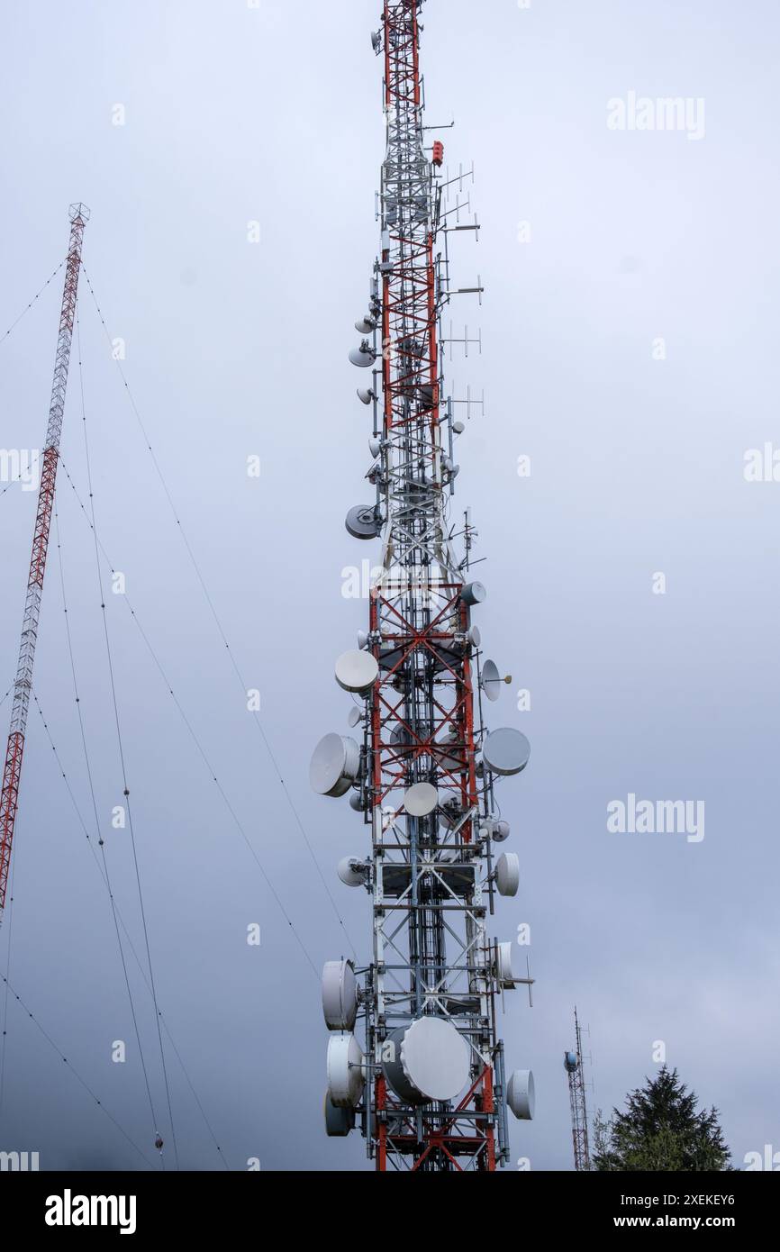 A tall tower stands prominently in the landscape, featuring a multitude ...