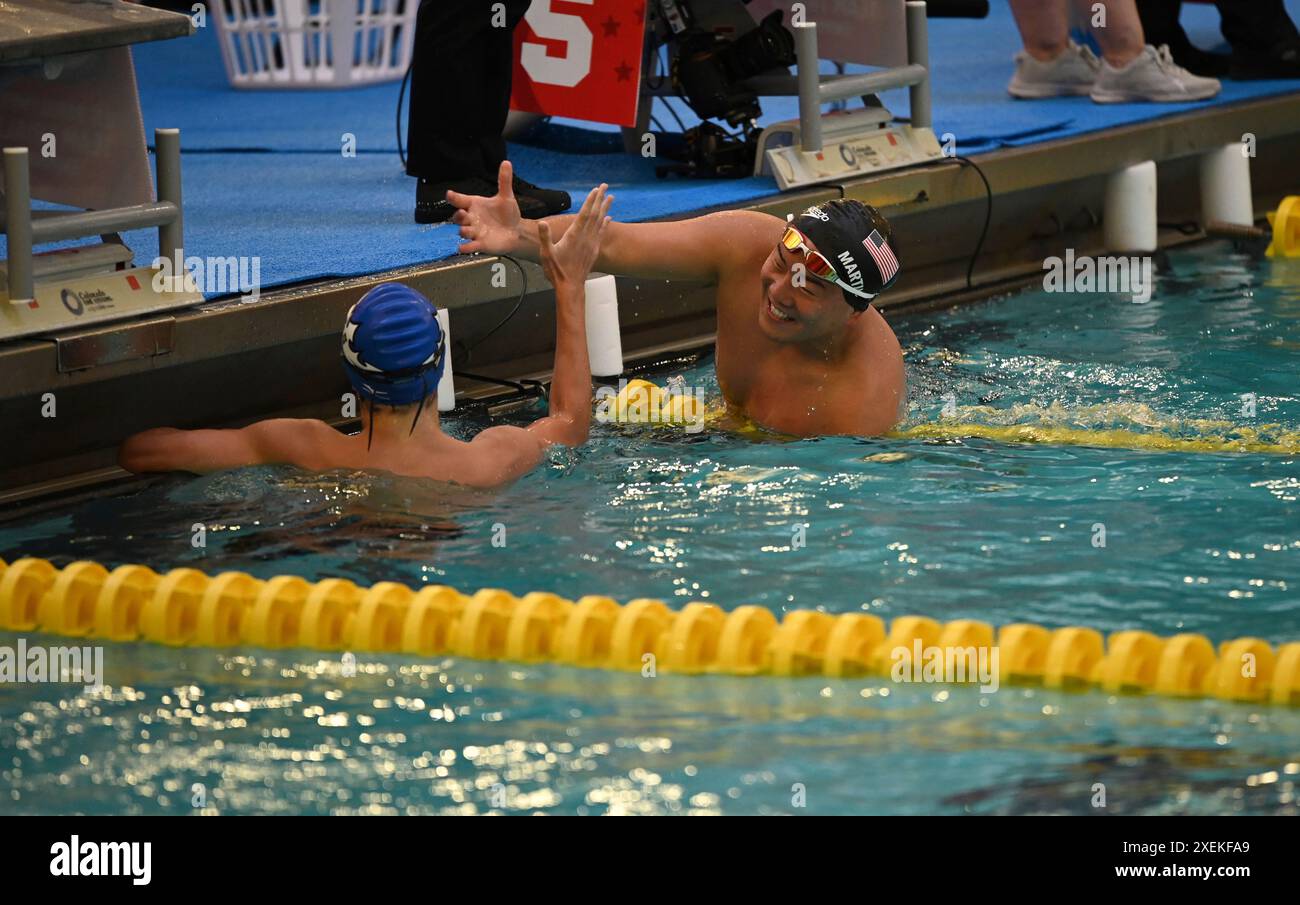 Emmett Martin, right, celebrates finishing the men's 100 breaststroke ...