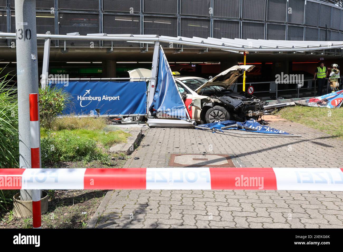 28 June 2024, Hamburg: Barrier tape marks the scene of the accident. A ...