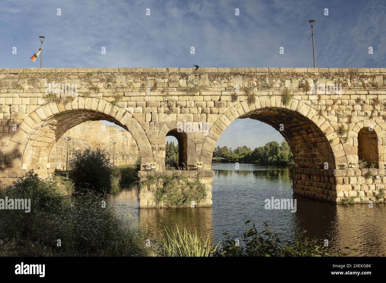 The ancient Roman bridge in Merida, Spain, spans the Guadiana River ...